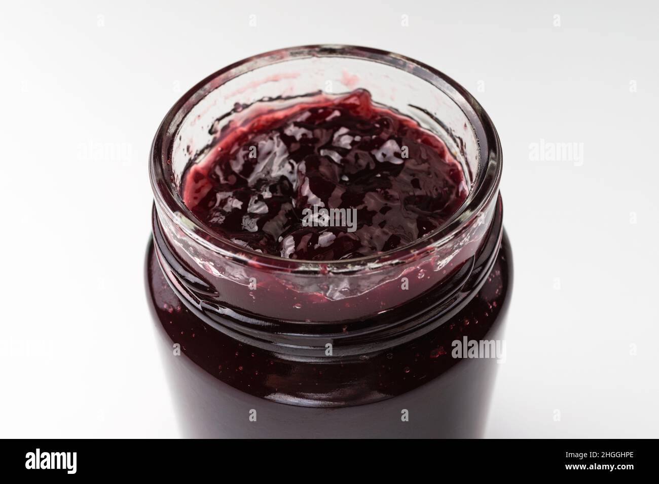 Grape jam on a white background Stock Photo - Alamy