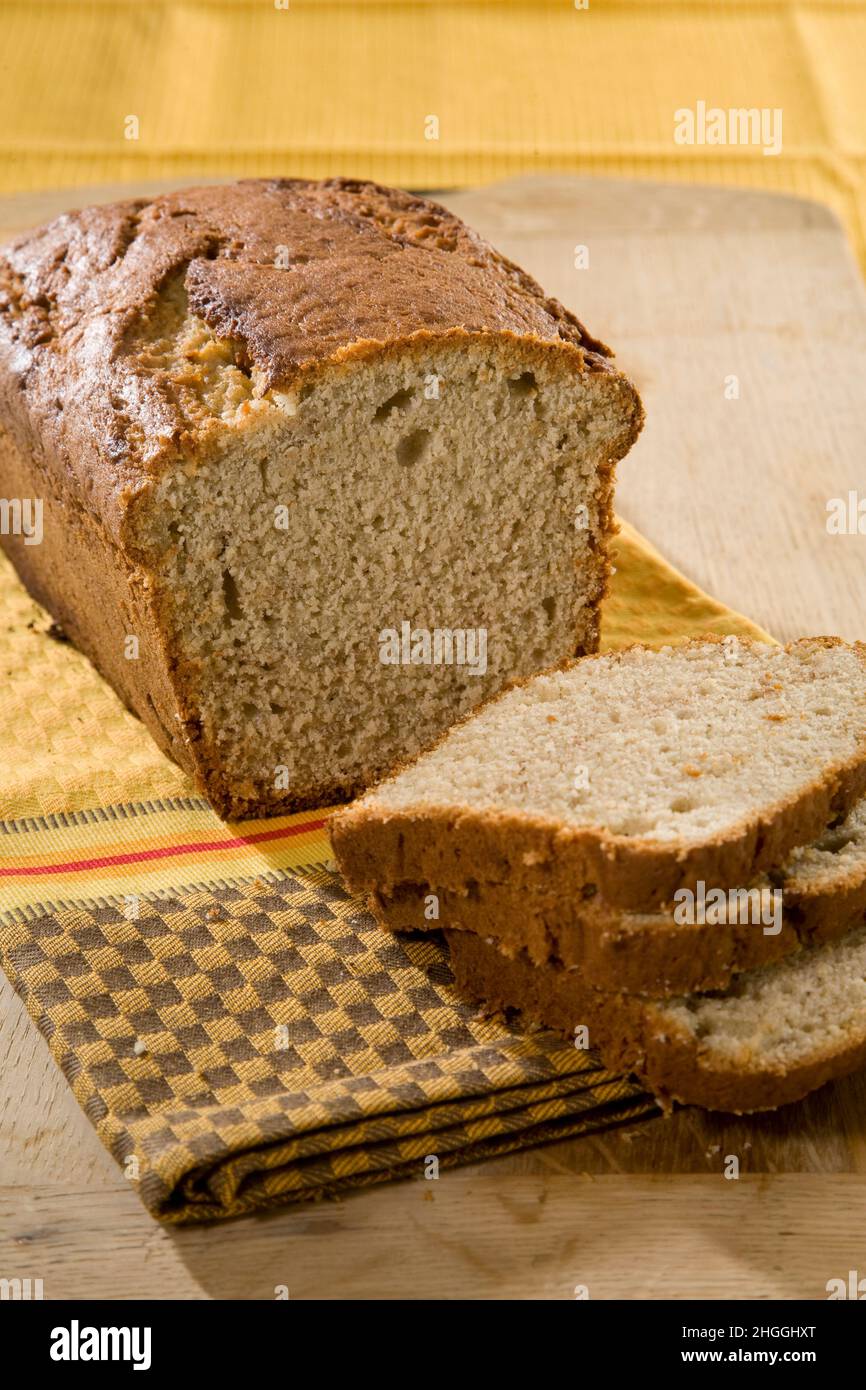 Delicious freshly baked bread, sliced and ready to serve in a homestyle ...