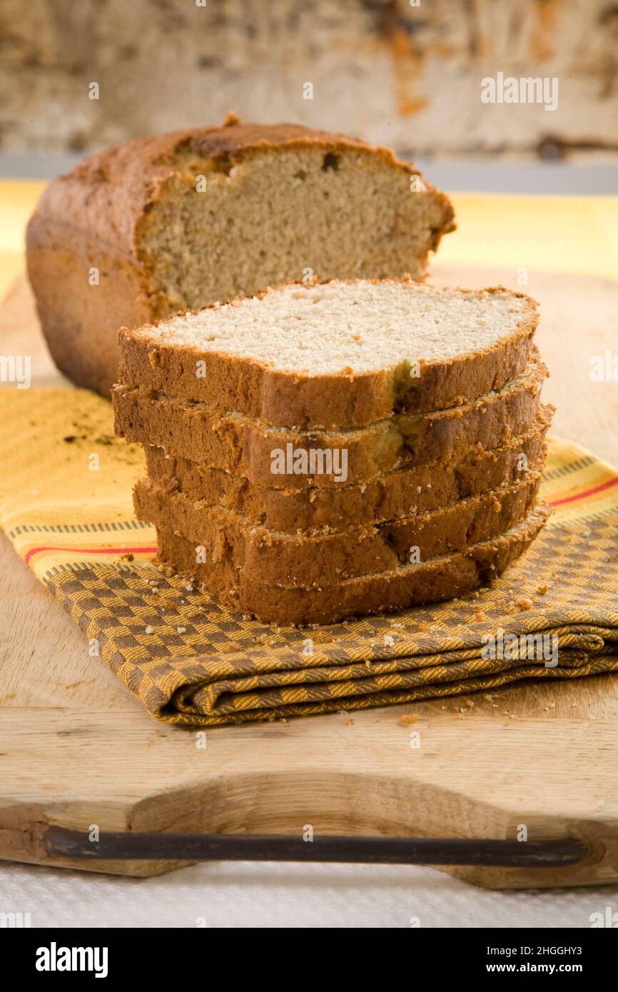 Delicious freshly baked bread, sliced and ready to serve in a homestyle ...