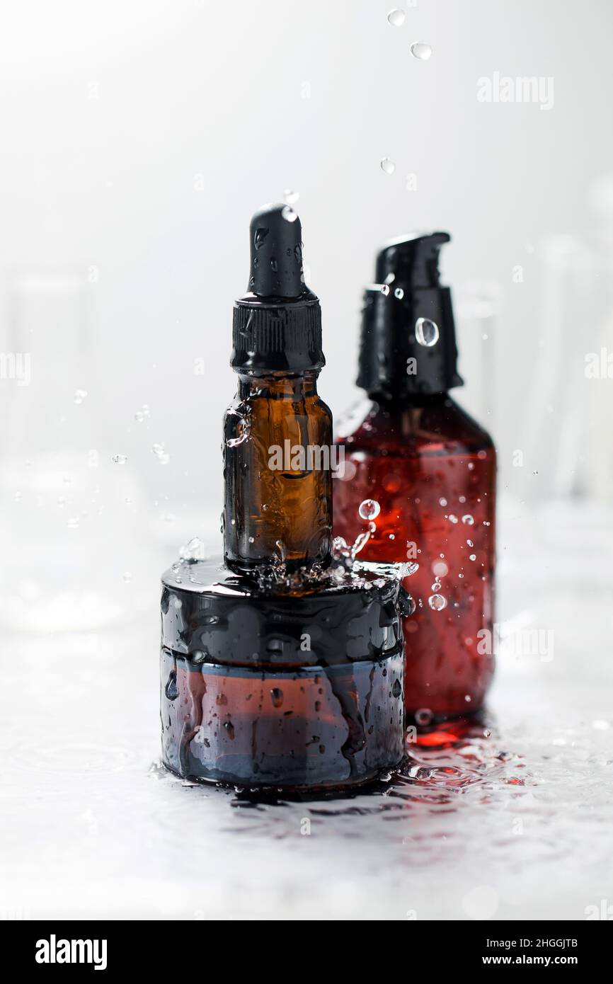 Organic cosmetic products are standing on the water and there are ...