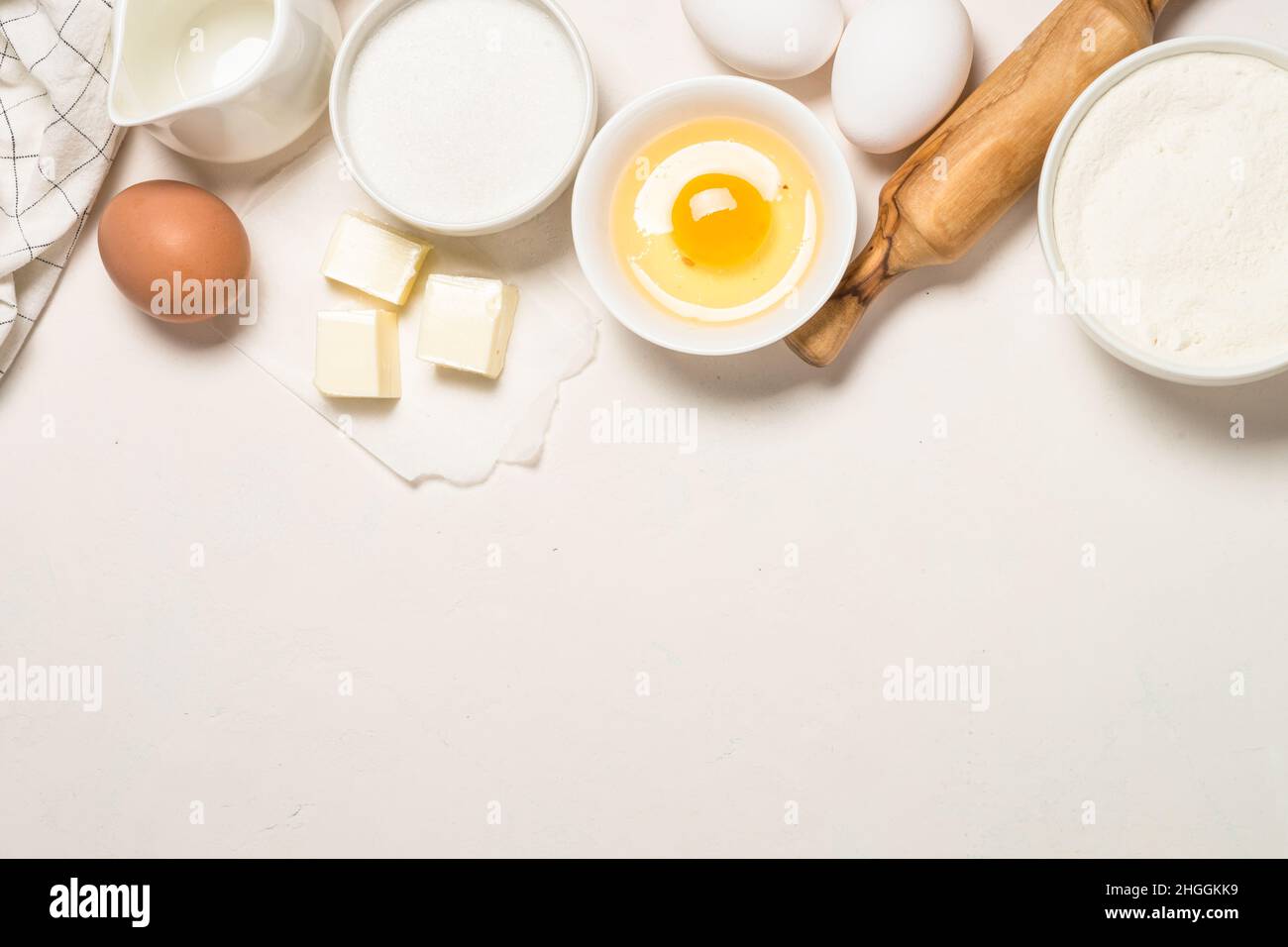 Baking ingredients at blue table top view Stock Photo - Alamy