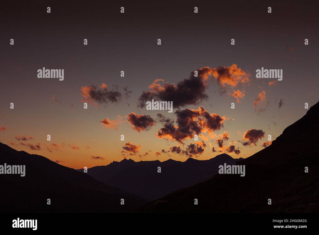 Awesome color effects in a mountain summer sunset Stock Photo - Alamy