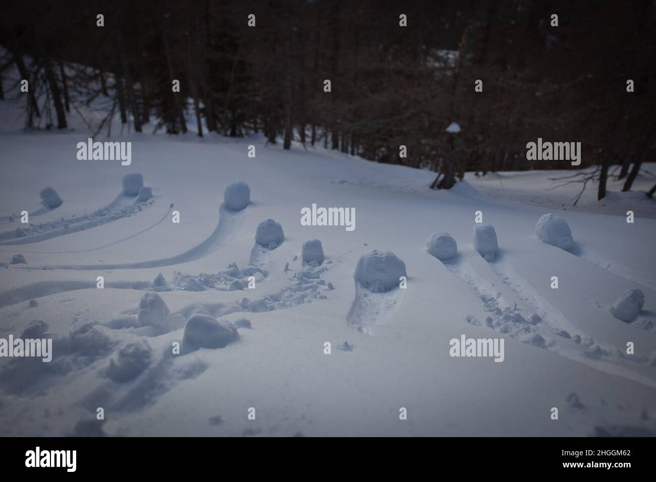 Tilt shift effect of wheel-shaped snowballs formed by rolling down a ...