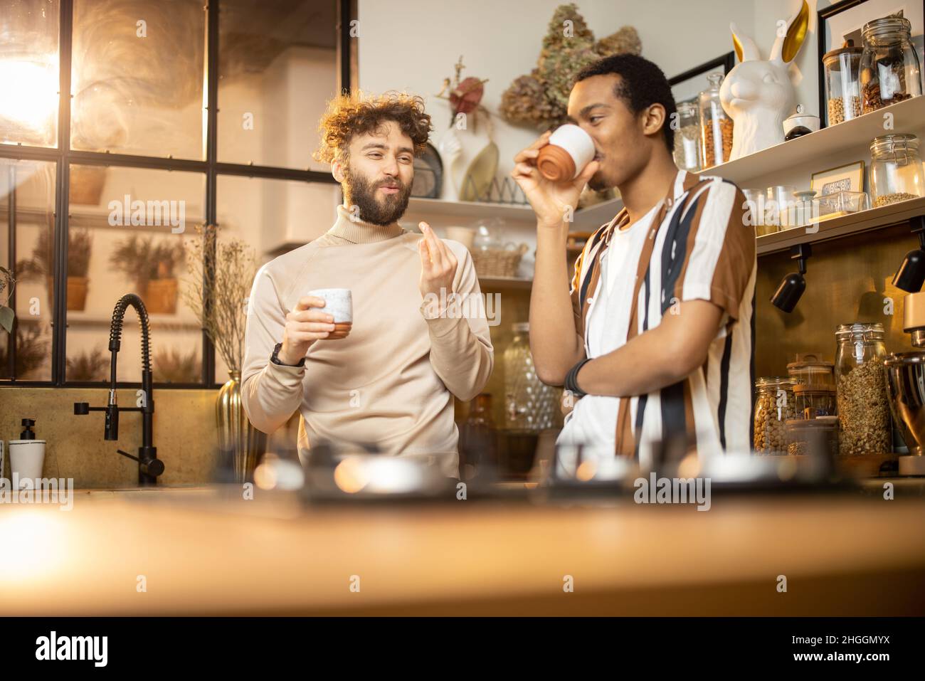Latino couple talking kitchen hi-res stock photography and images - Alamy