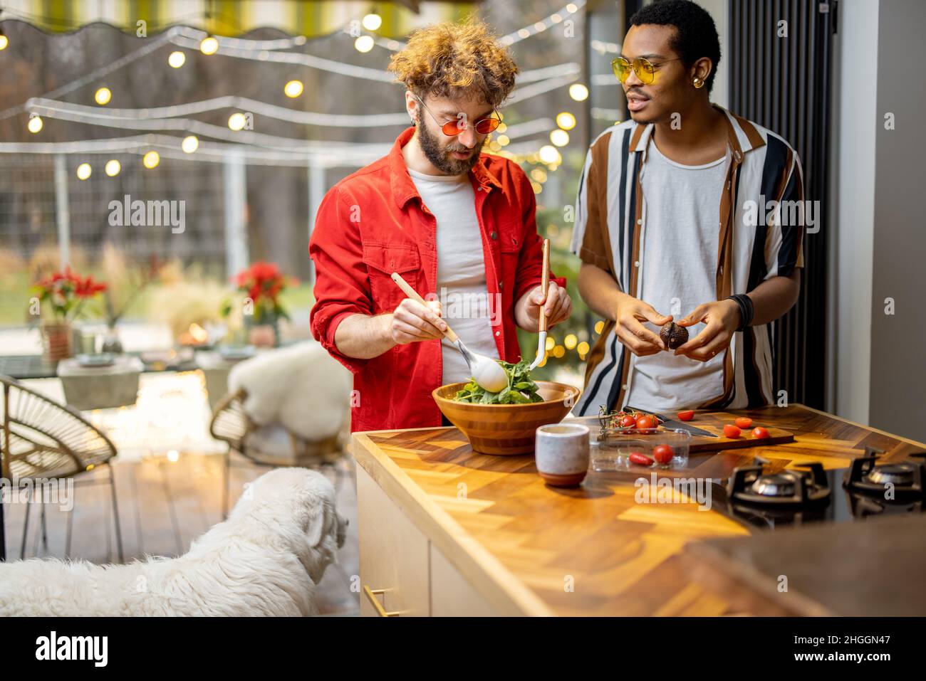 Two guys cooking healthy together at home Stock Photo - Alamy