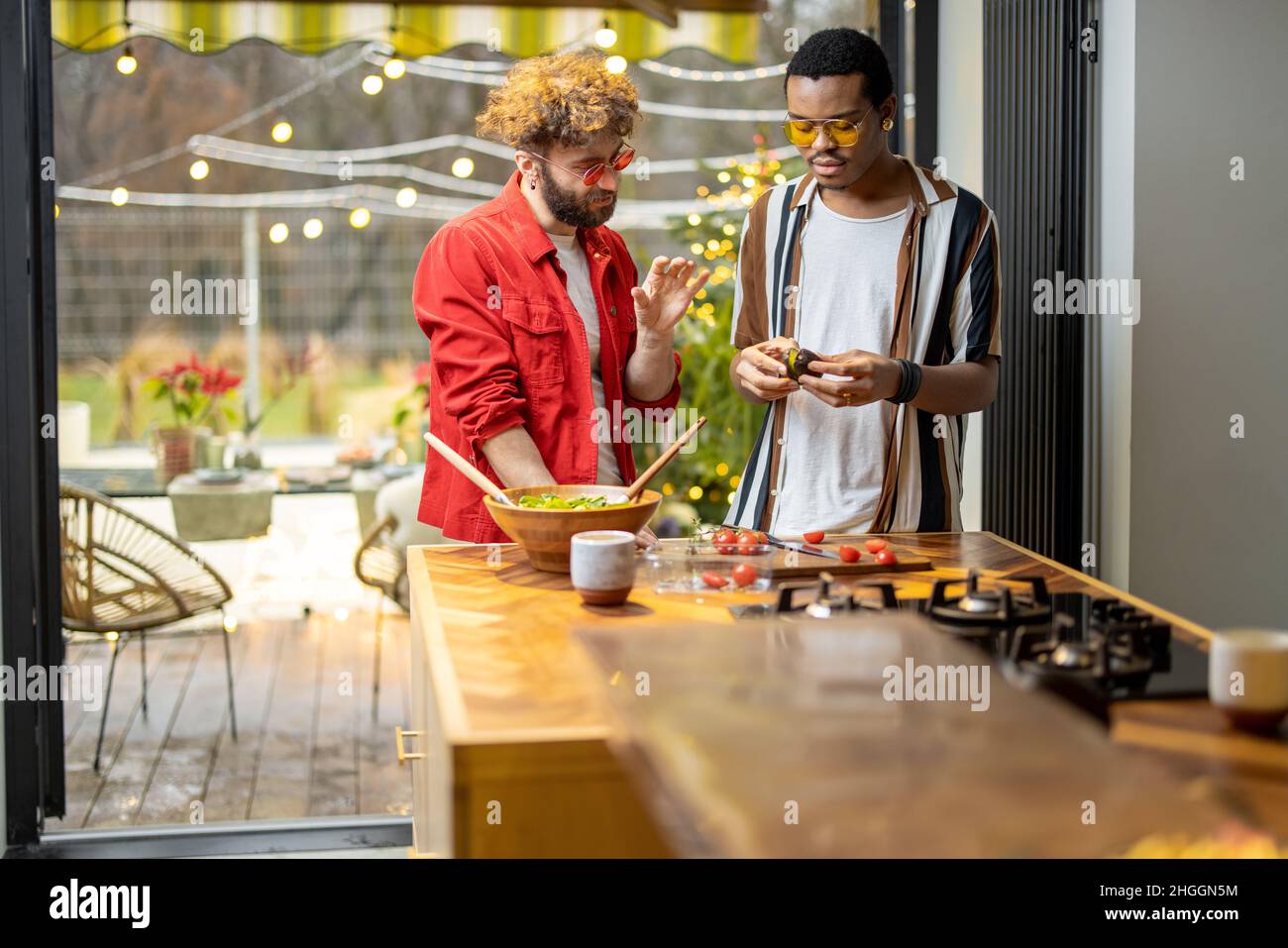 Two guys cooking healthy together at home Stock Photo - Alamy