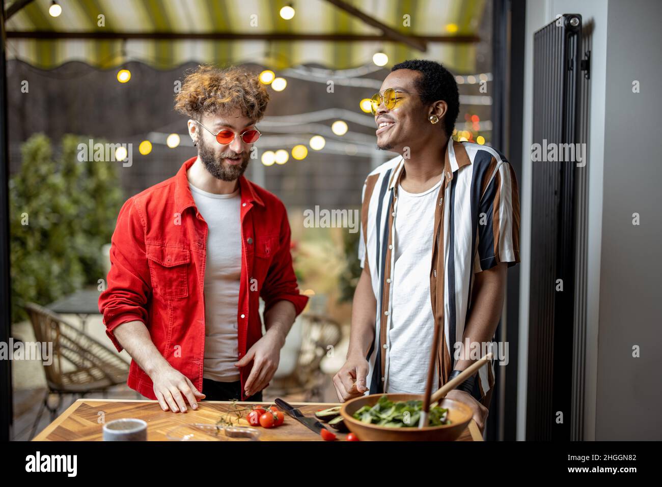 Two guys cooking healthy together at home Stock Photo - Alamy