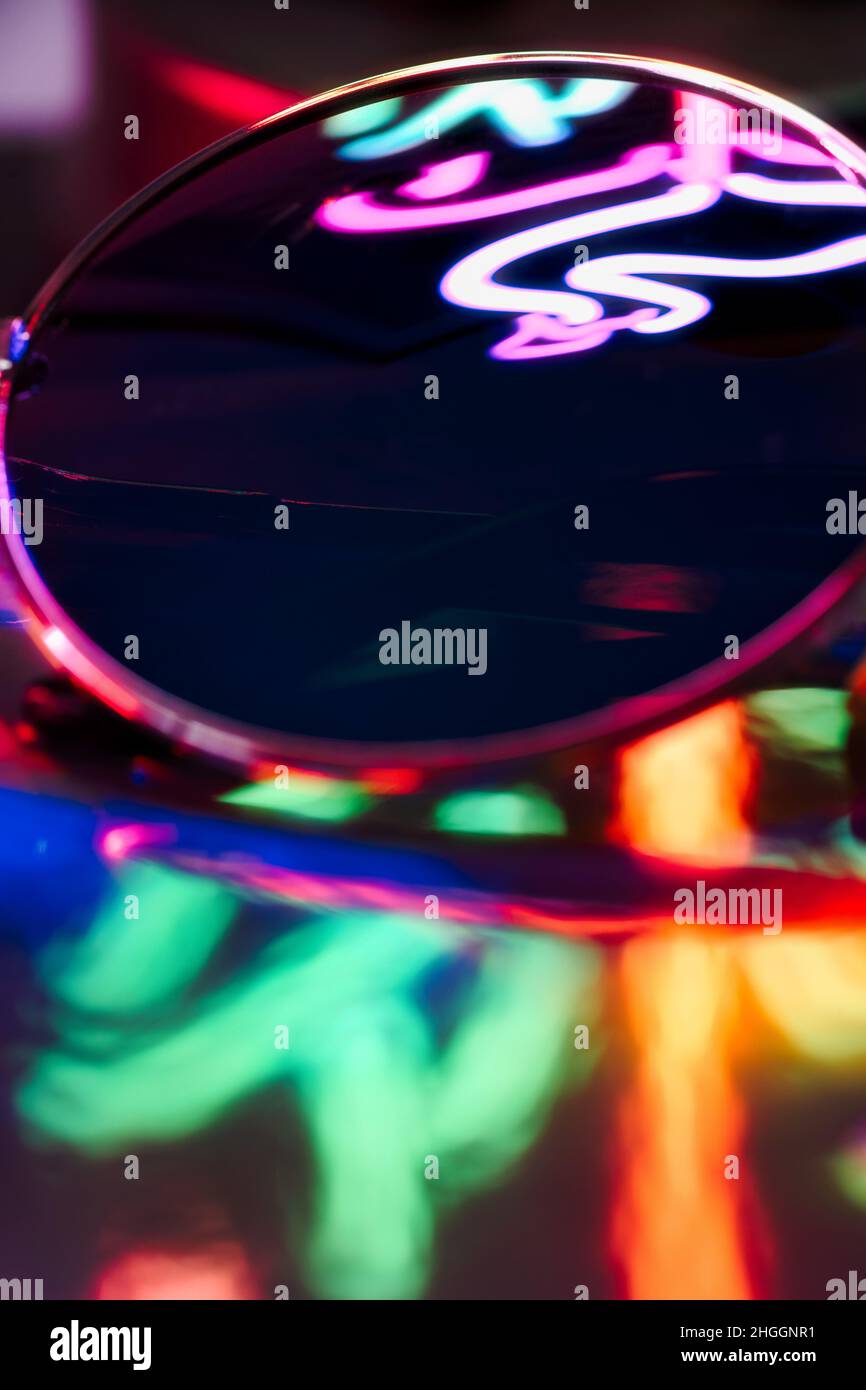 Abstract artistic Neon flamingo in round sunglasses reflection. Party ...