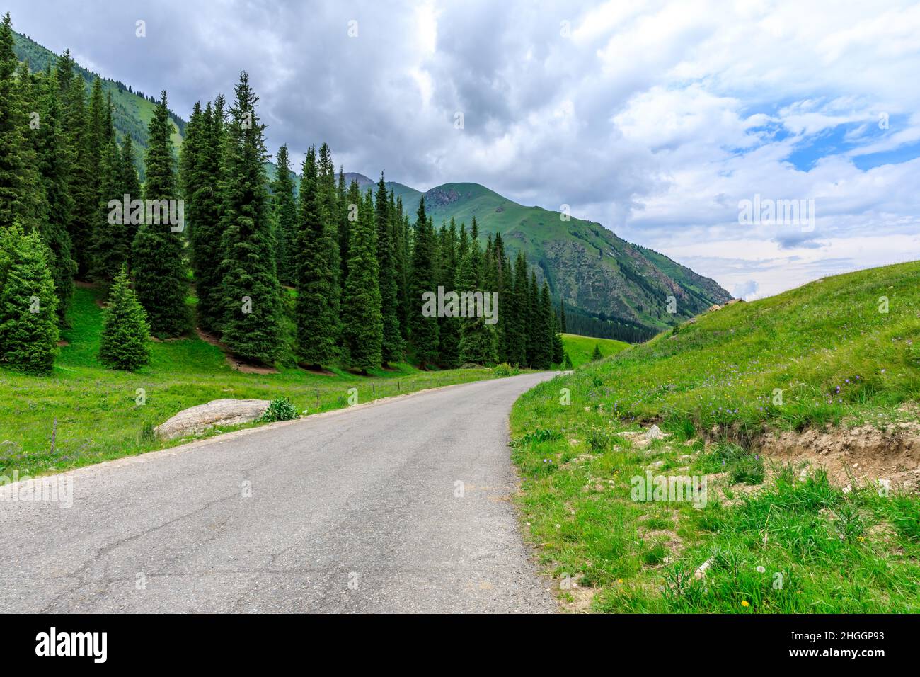Asphalt road and green mountain natural landscape in Xinjiang,China ...