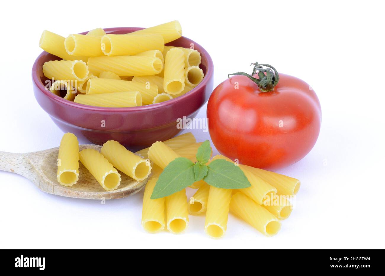 Italian pasta, rigatoni with fresh tomato and basil Stock Photo - Alamy