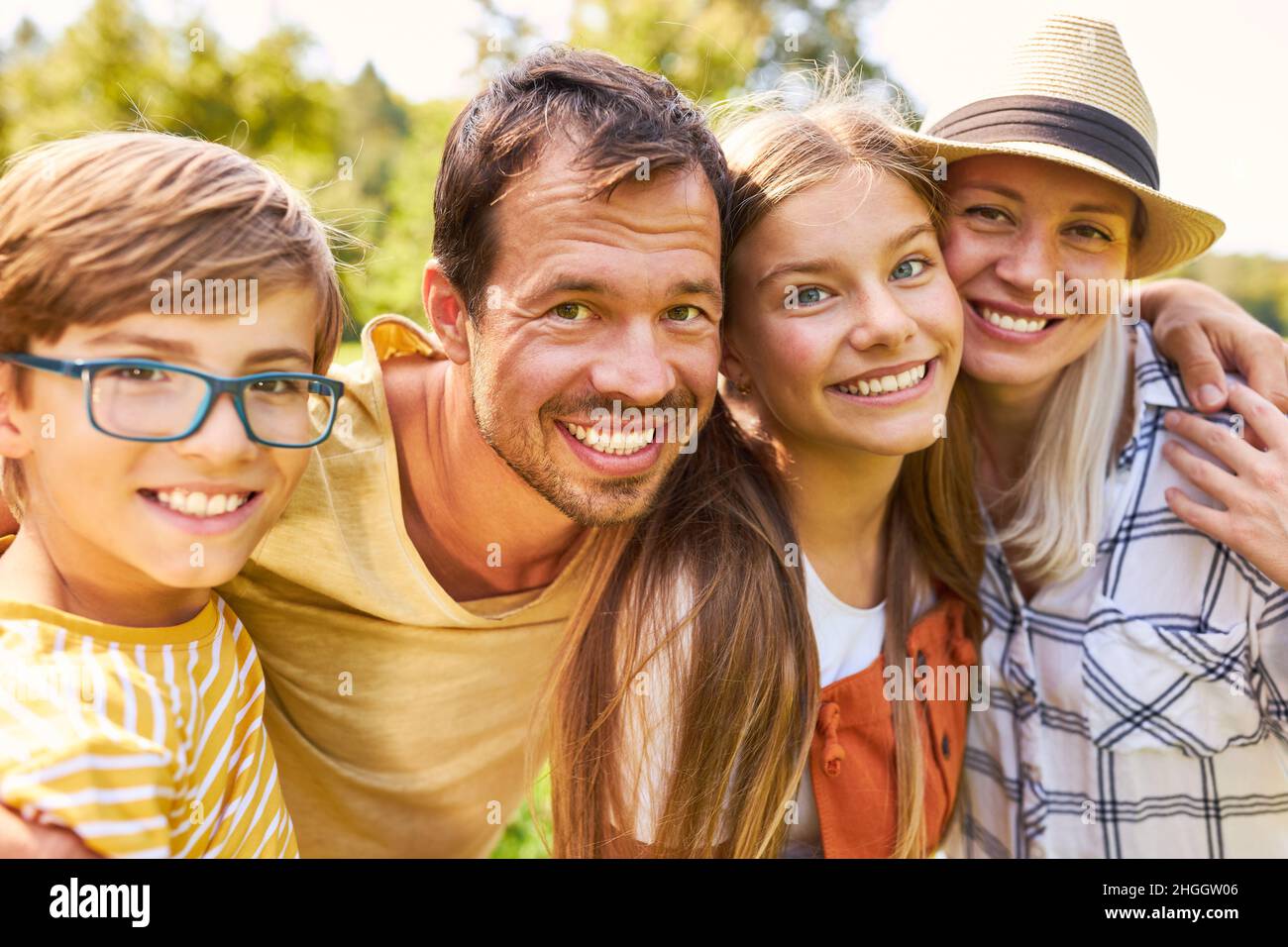 Parents and siblings children together as a happy small family in ...