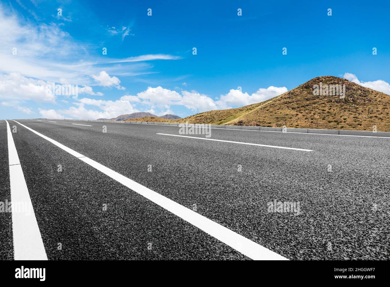 Highway ground and mountain natural scenery under blue sky.Landscape ...