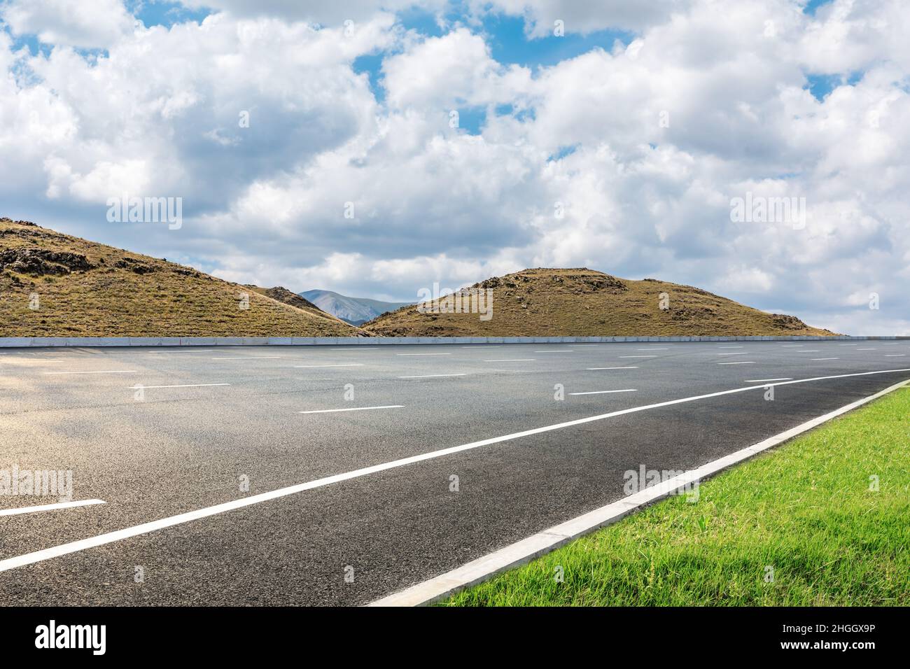 Highway ground and mountain natural scenery under blue sky.Landscape ...