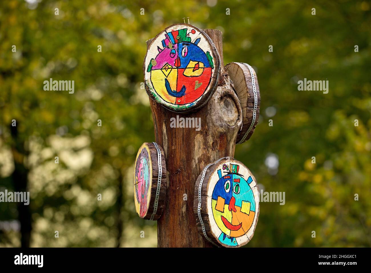 Artwork Tree snag with painted tree slices, colourful painings made by ...