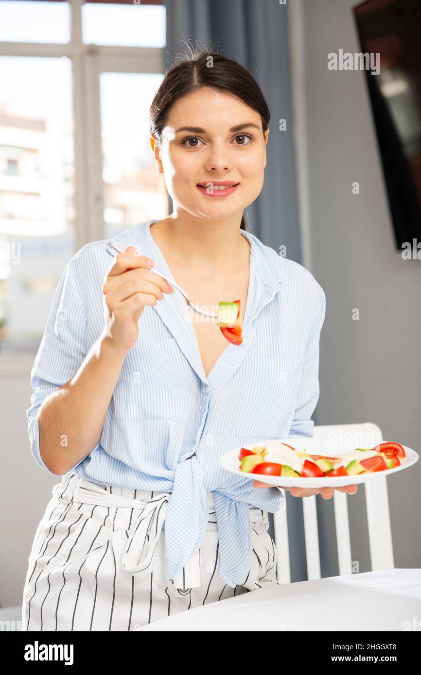 Woman alone eating avocado hi-res stock photography and images - Alamy