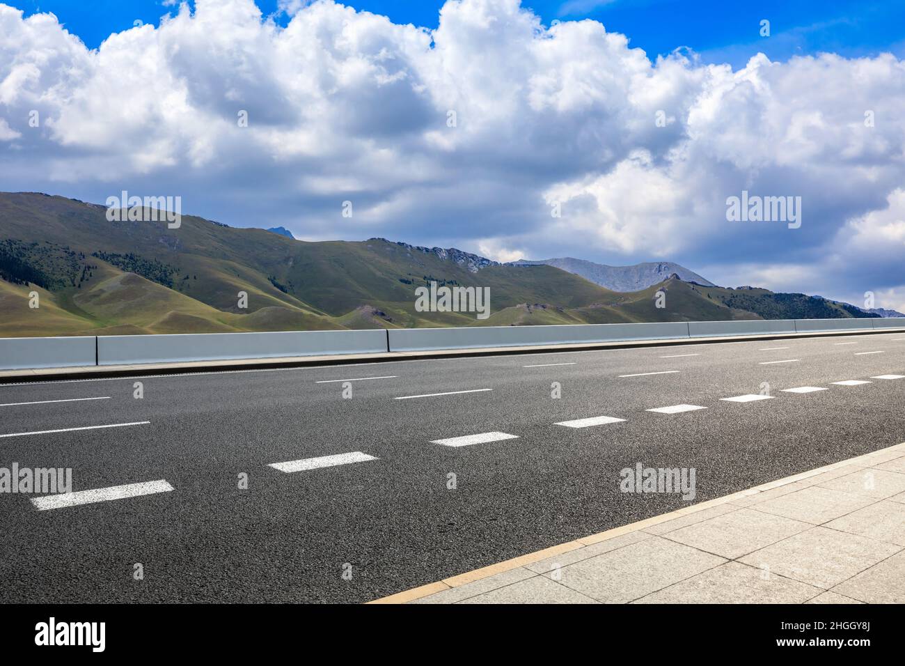 Highway ground and mountain natural scenery under blue sky.Landscape ...