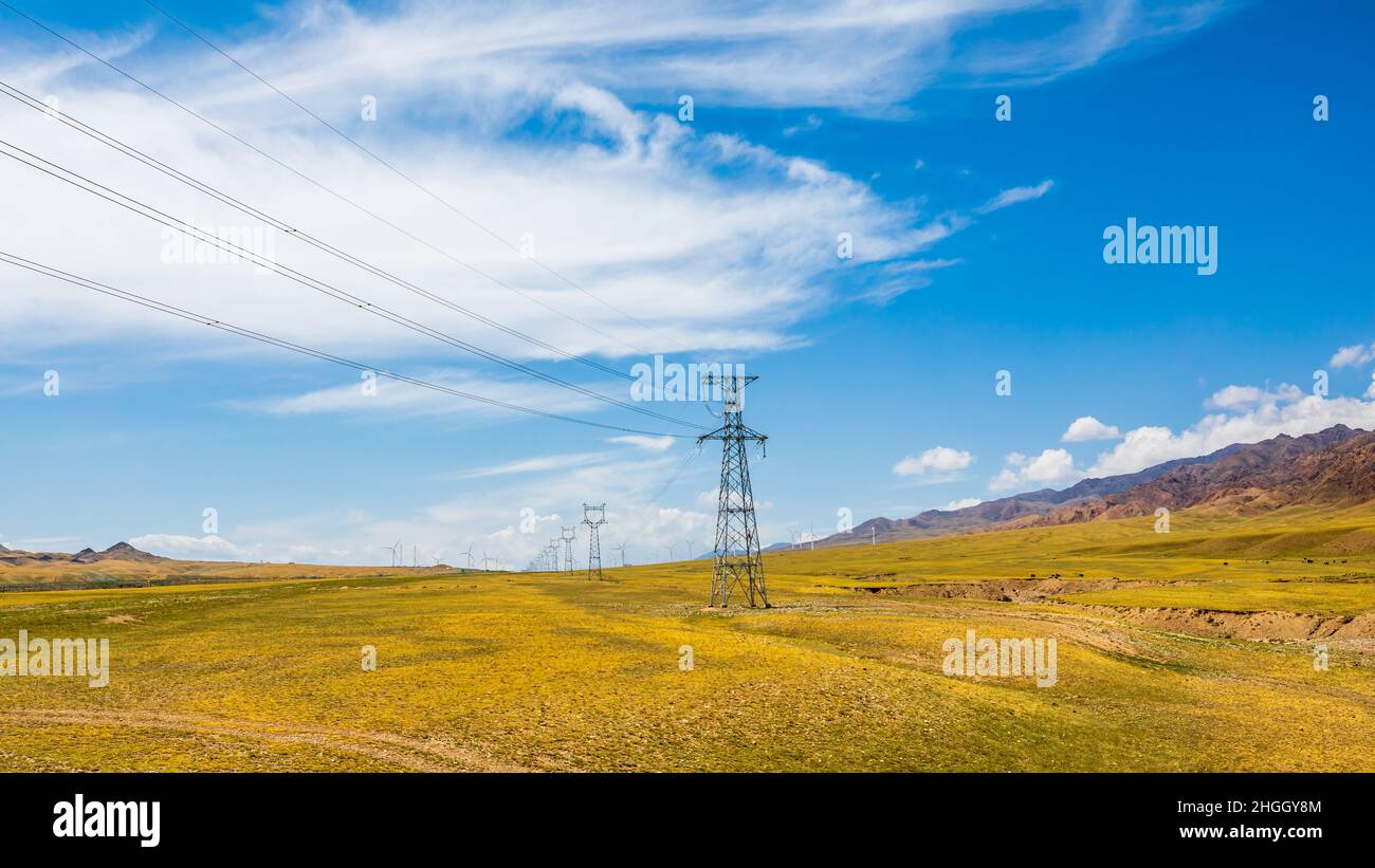 High voltage power tower and beautiful mountain scenery in Xinjiang ...