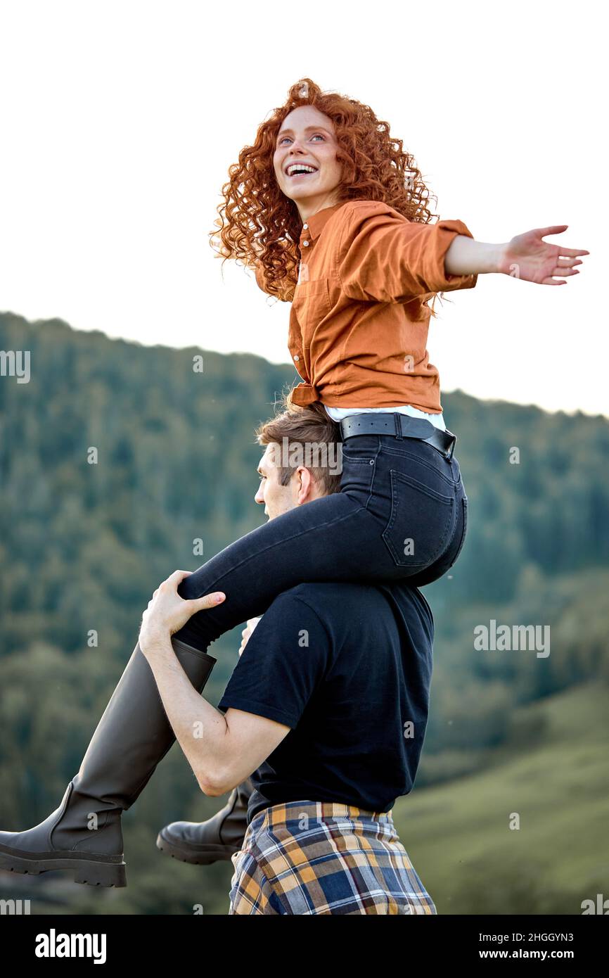 Happy couple holding hands walking through a meadow, tinted photo Stock ...