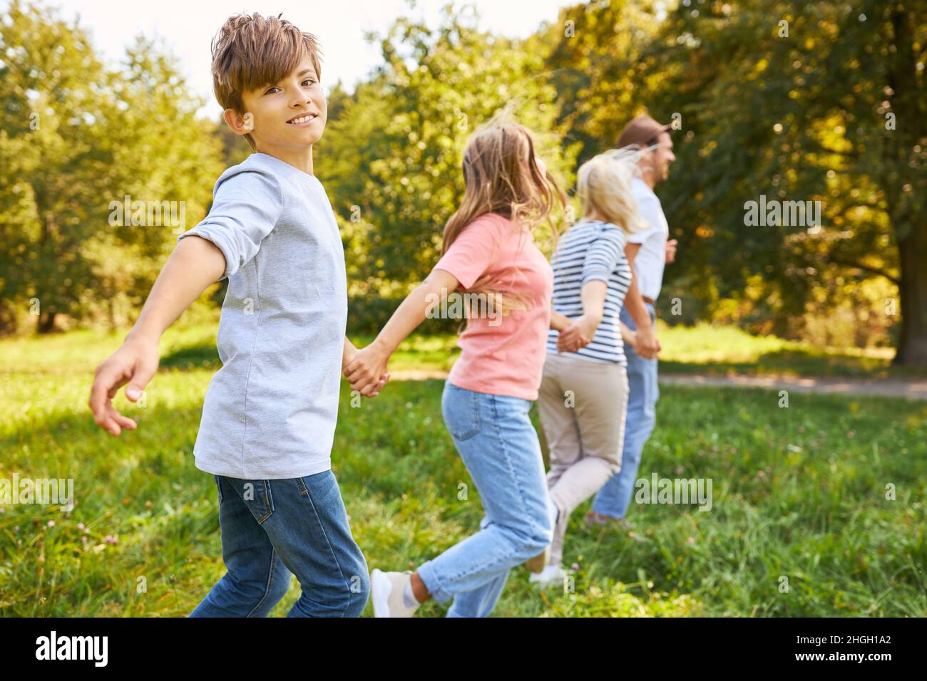 Mother daughter running hand hand park hi-res stock photography and ...