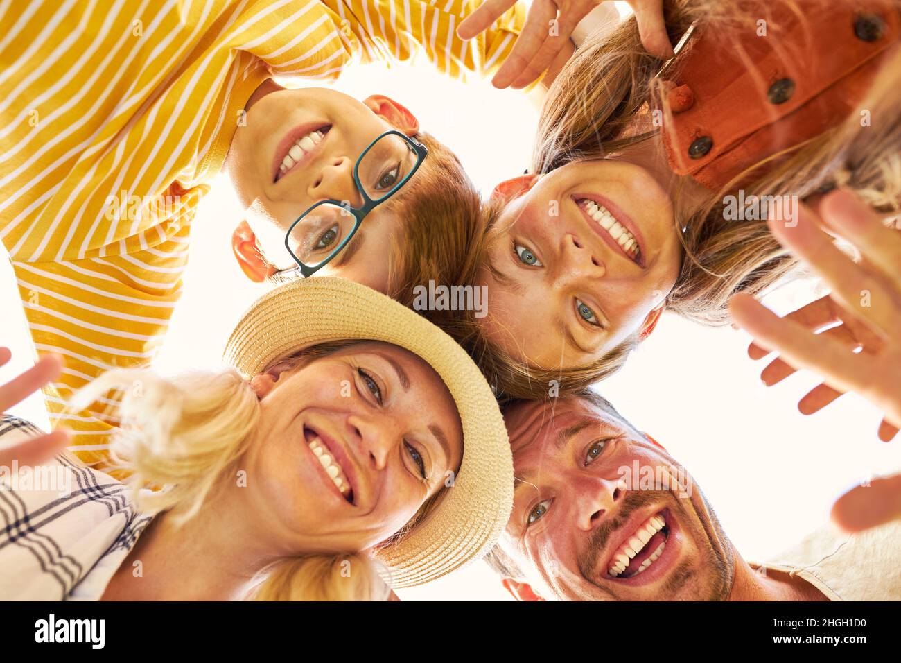 Laughing parents and children have fun together as happy small family ...