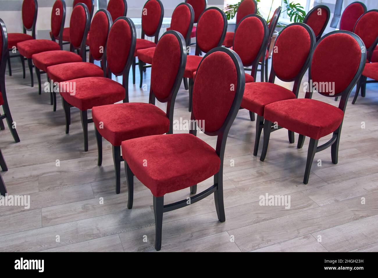 Classic rows of empty reddish seats in theatre. Hall without visitors ...