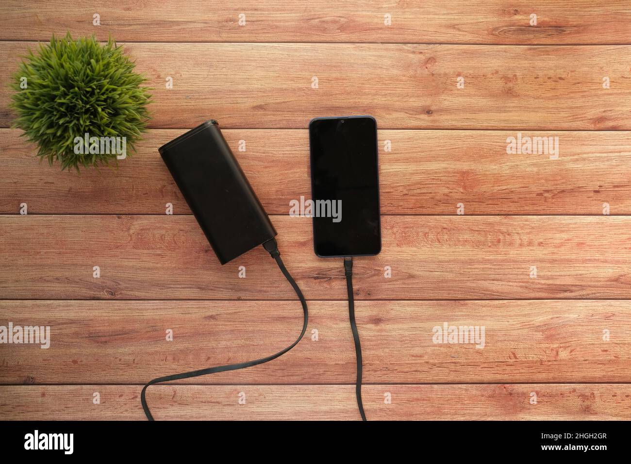 smart phone charging with Power bank top view Stock Photo - Alamy