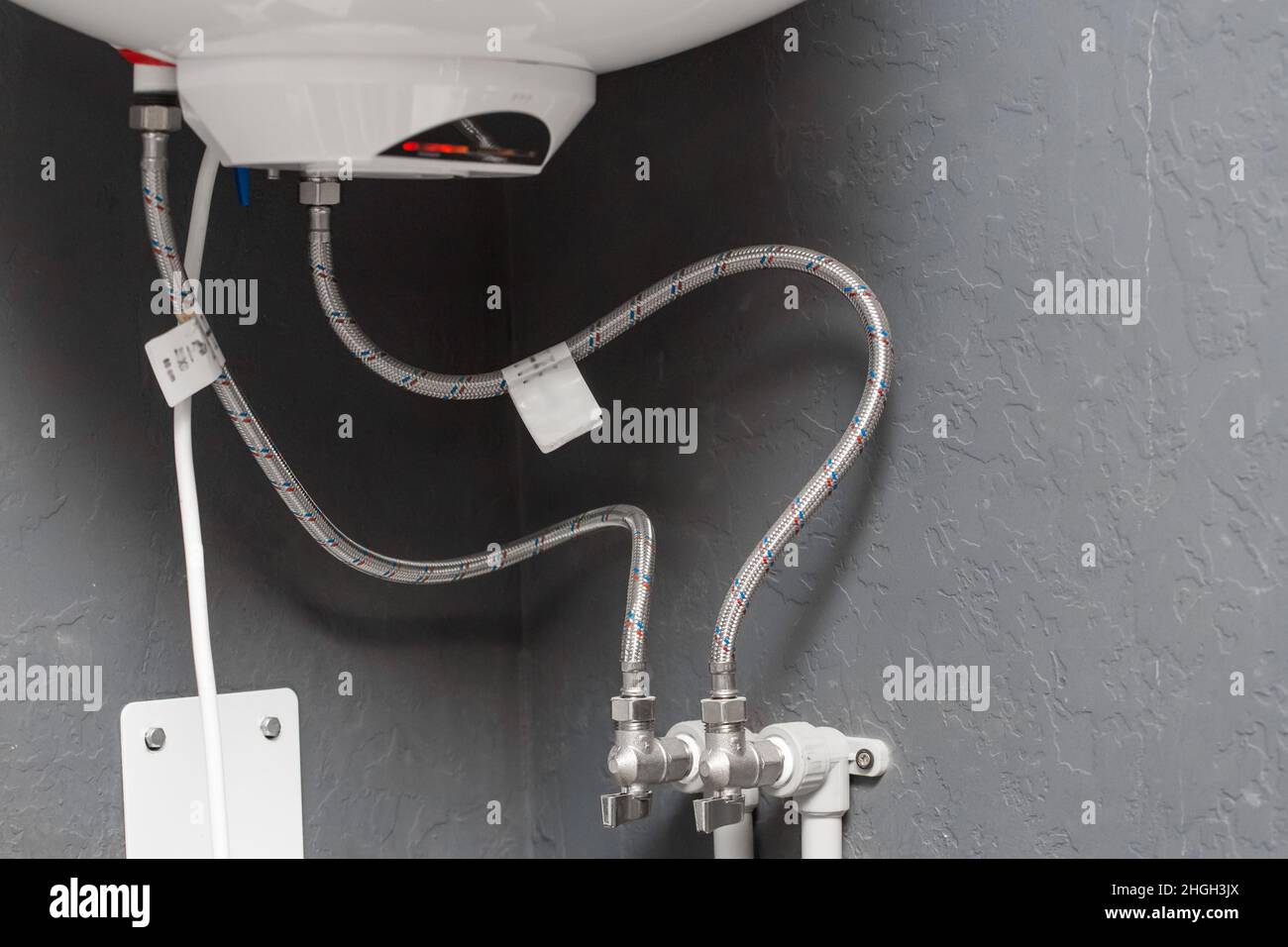 System for connecting hot and cold water hoses to the boiler Stock ...