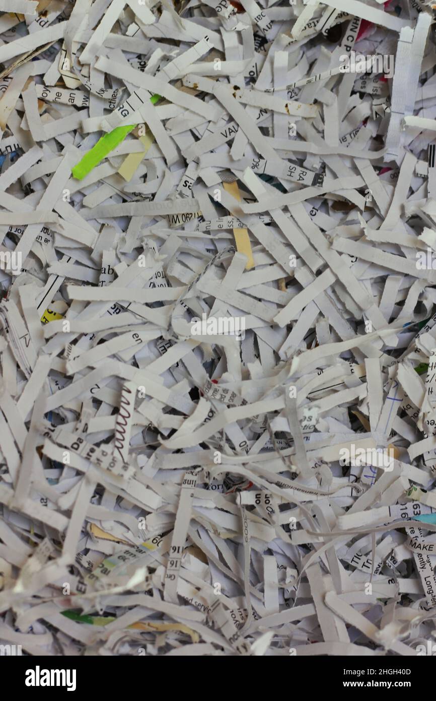 Full frame closeup of a pile of shredded paper and confidential ...
