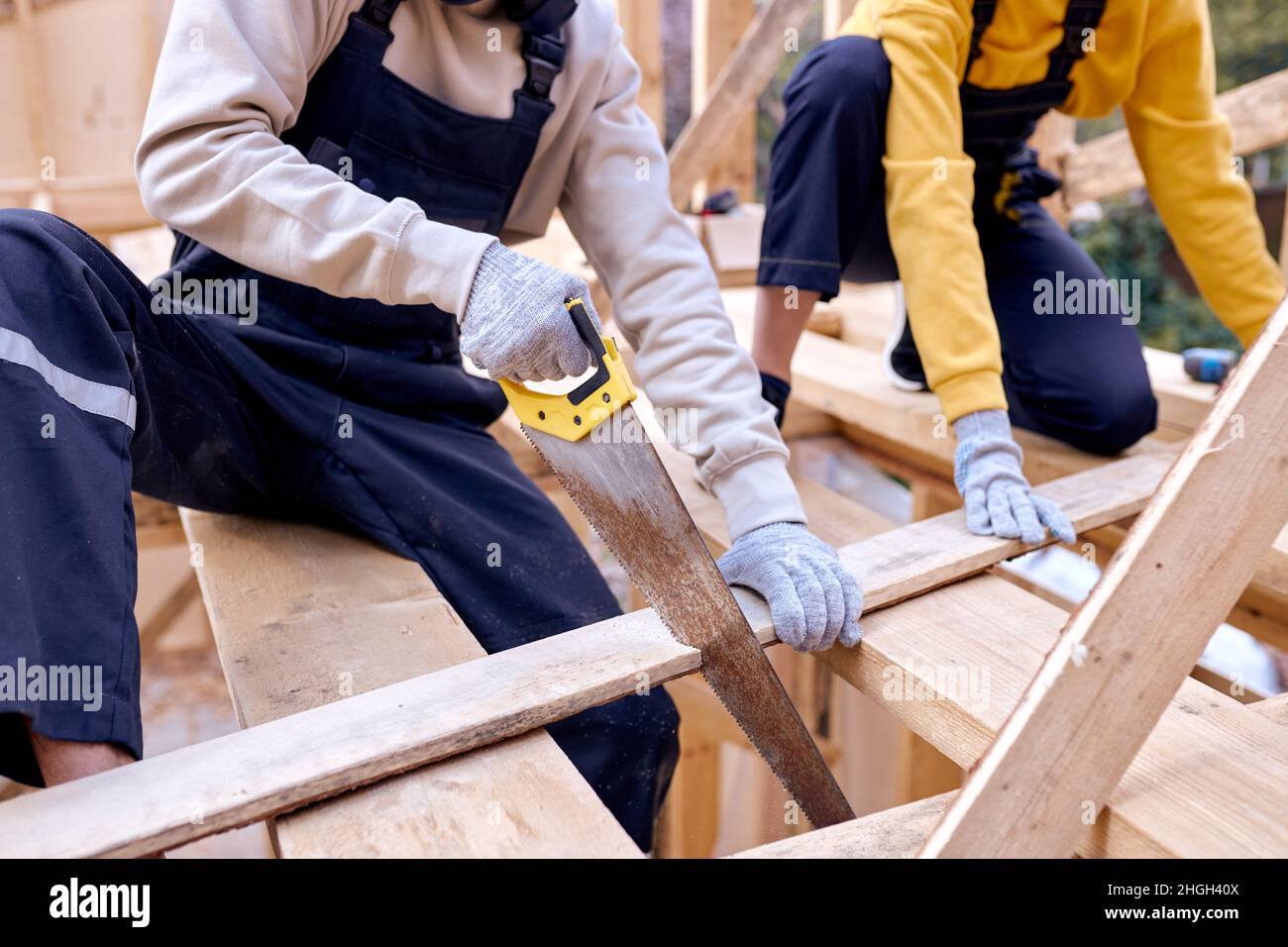 Caucasian Contractors Carpenters Workers Using Wood Saw in Construction ...