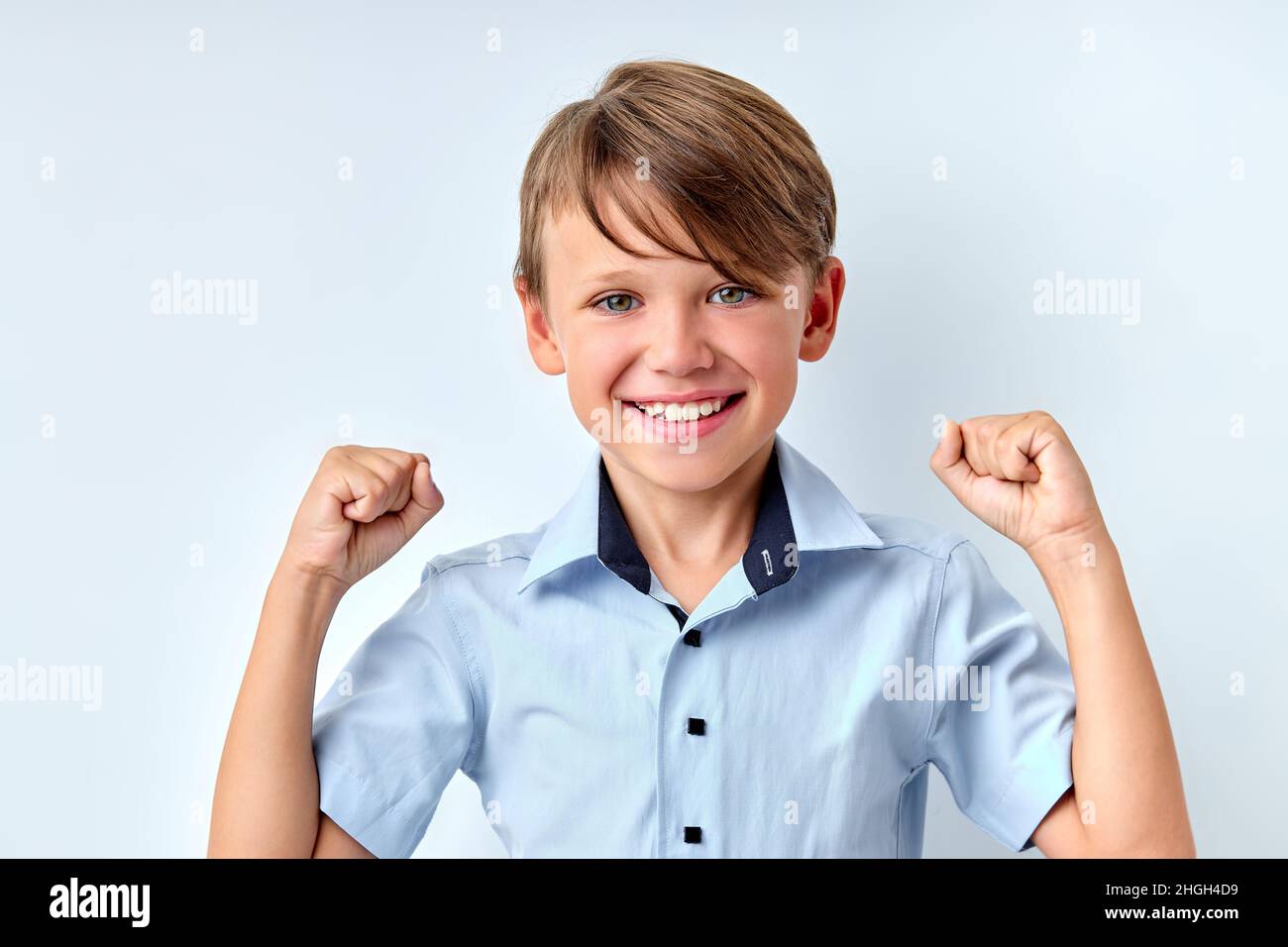 Little boy raising hands up, rejoicing. Success, Winner, Genius ...