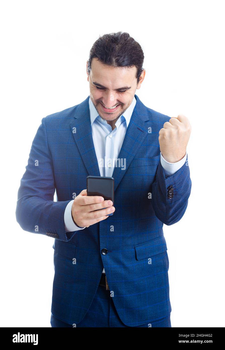 Portrait of thankful and pleased businessman keeps fist raised up ...