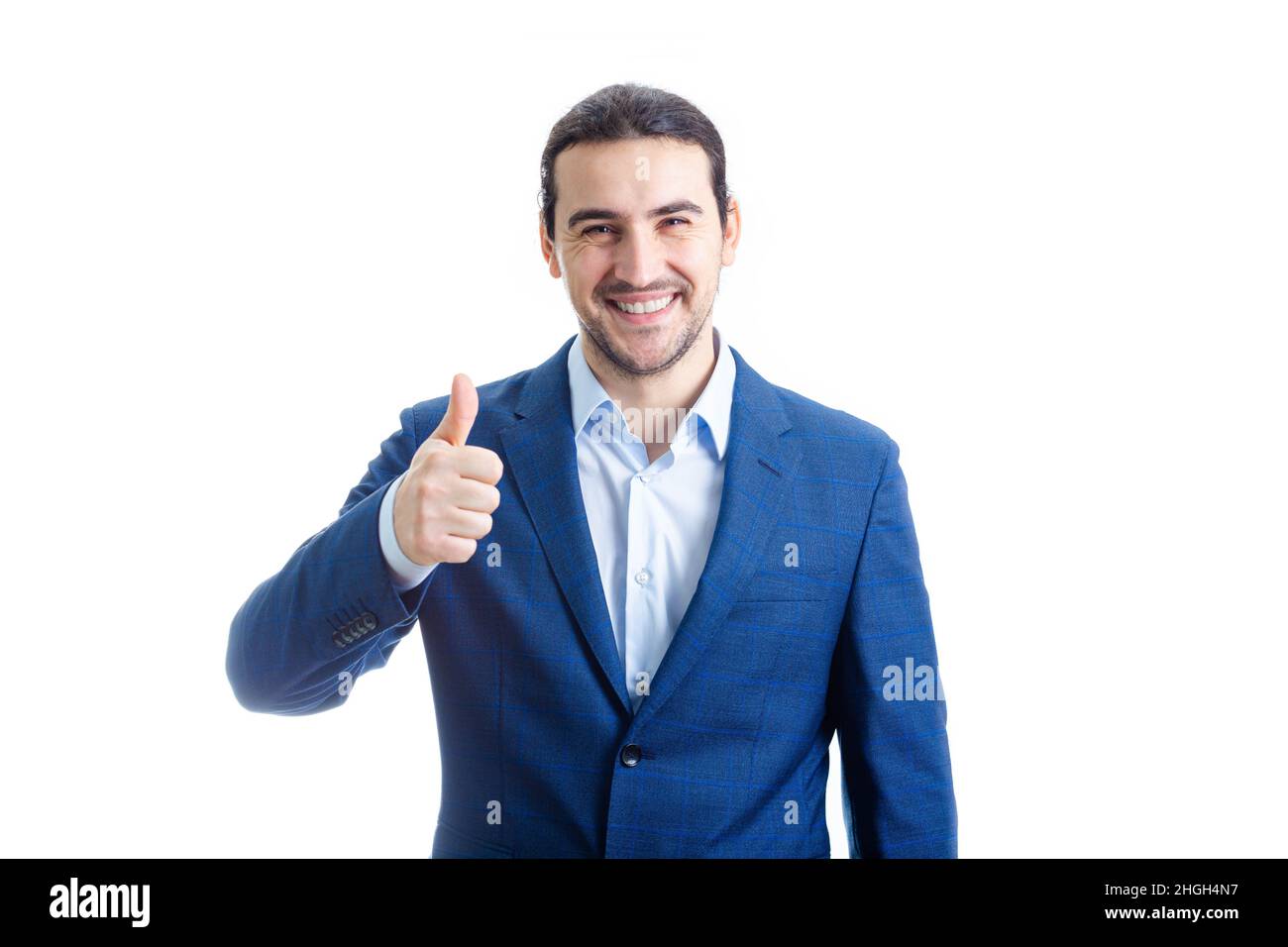 Portrait cheerful businessman smiling broadly showing thumb up gesture ...