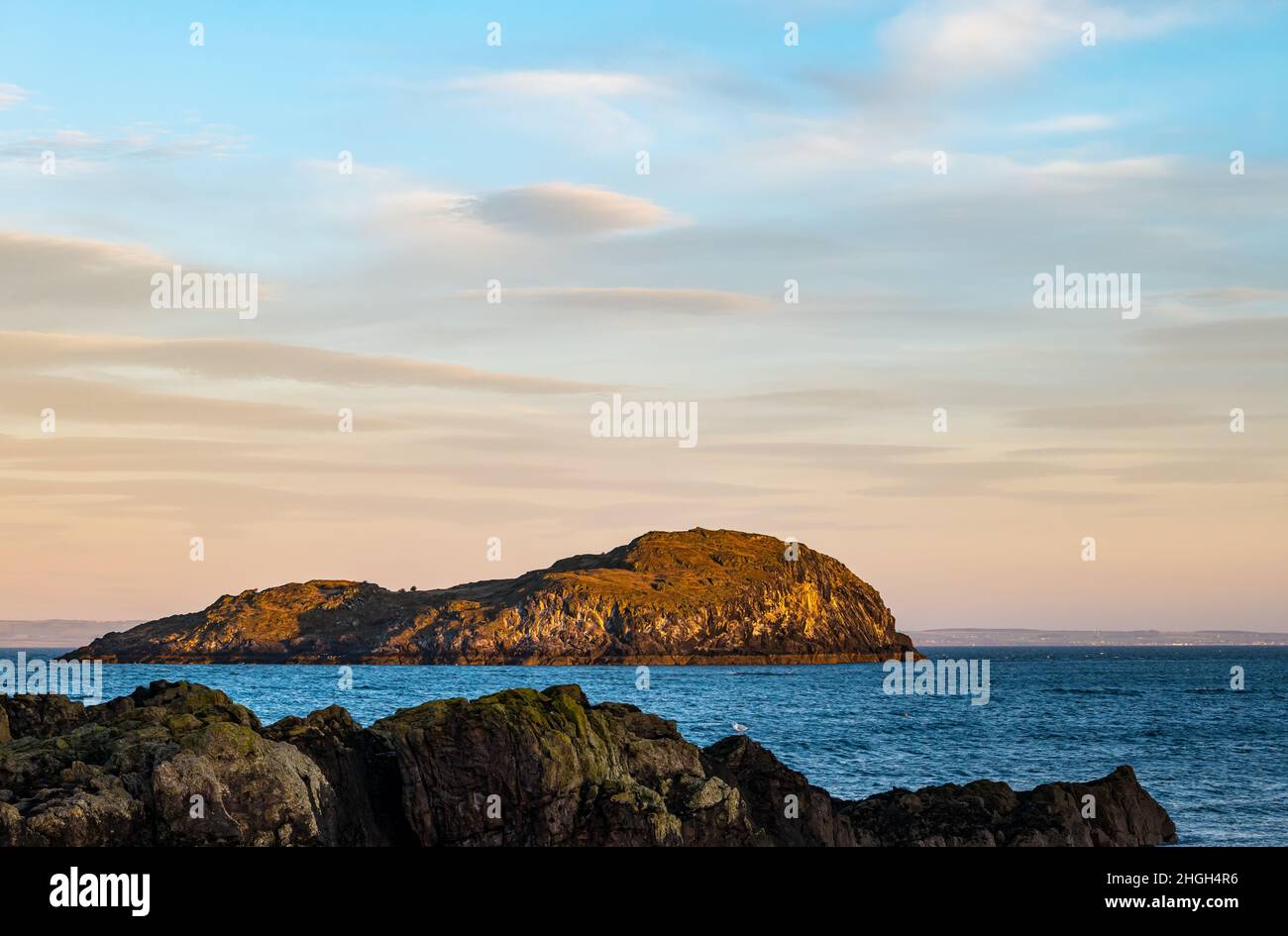 Craigleith Island in the Firth of Forth sea on the horizon at dawn ...