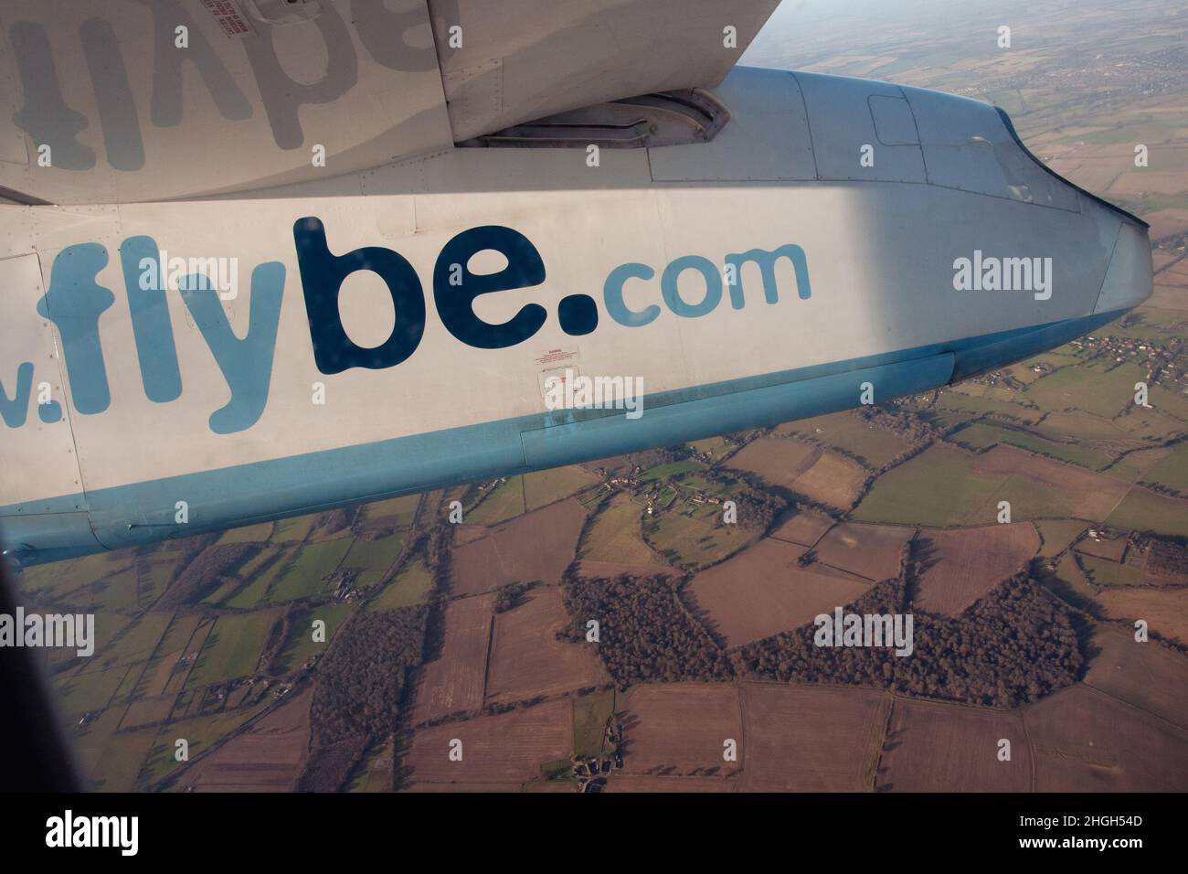 Shots of the Flybe logo on the side of the aircraft from the window of ...