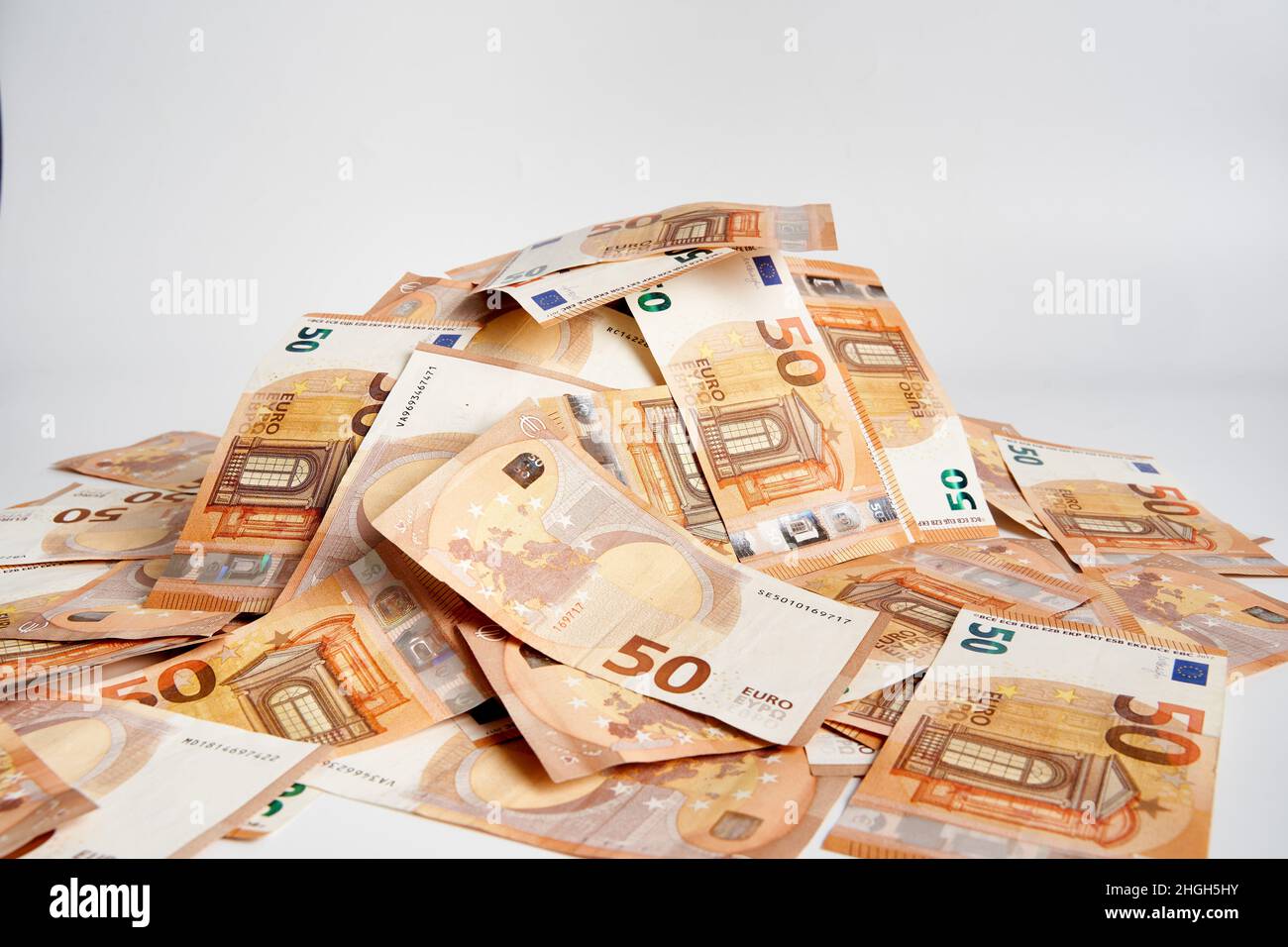 Euro bills on white background, symbol of wealth Stock Photo - Alamy
