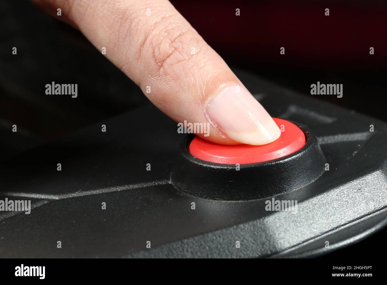 Pressing STOP or START button. Finger presses the red button Stock ...