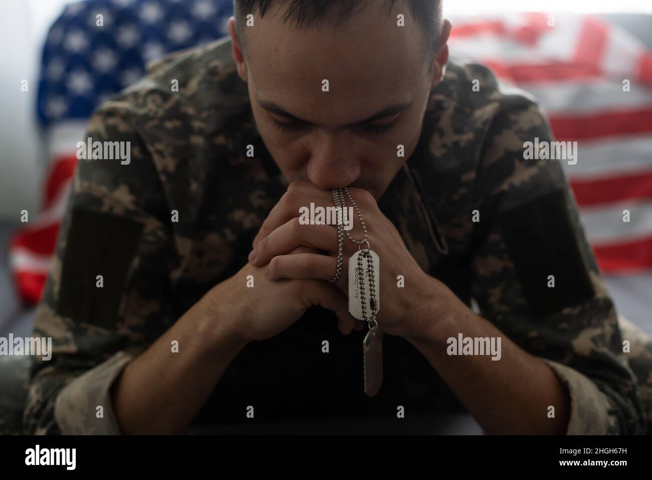 Sad man with USA flag background. Memorial Day celebration Stock Photo ...