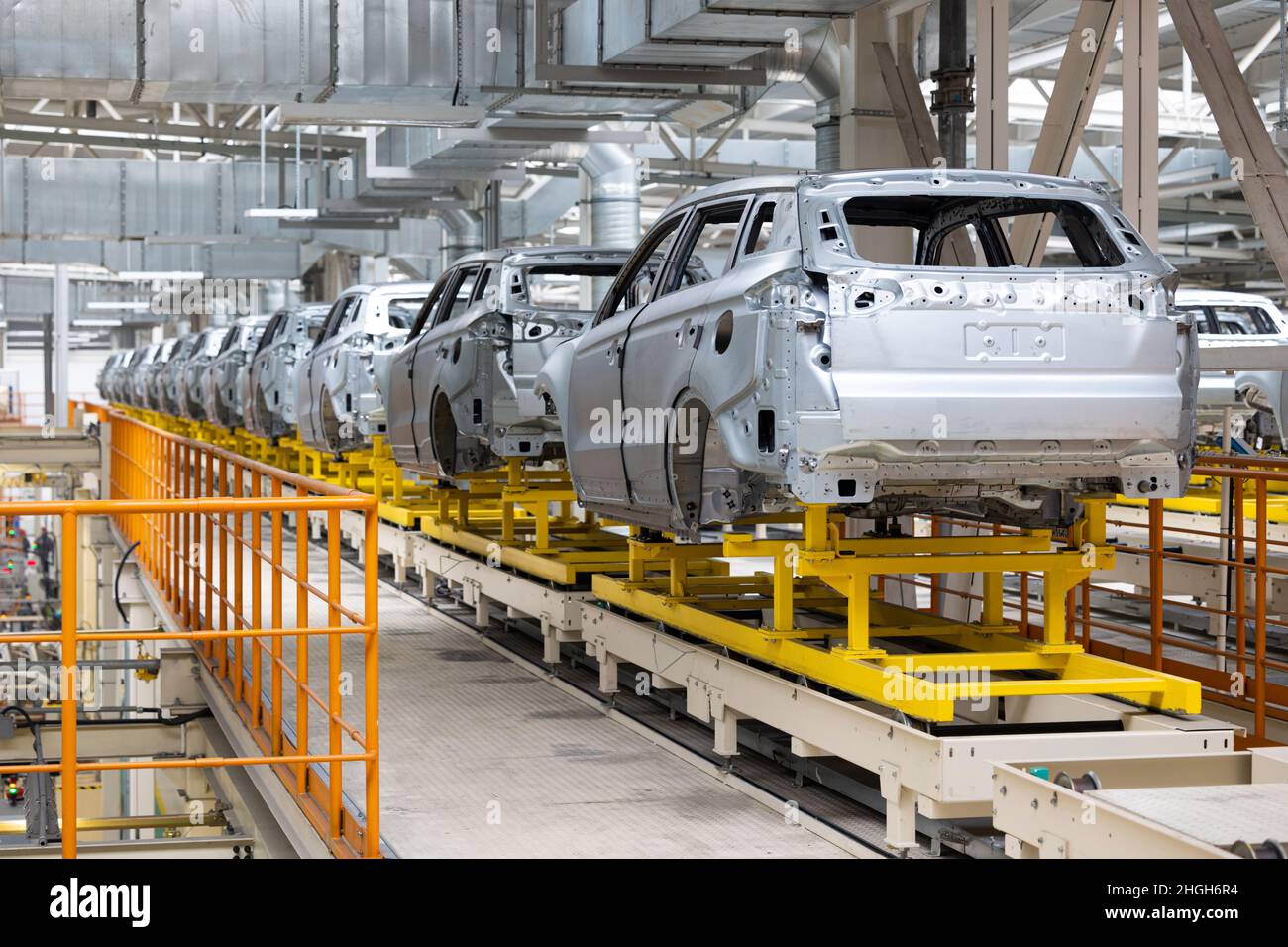 Photo of automobile production line. Welding car body. Modern car ...