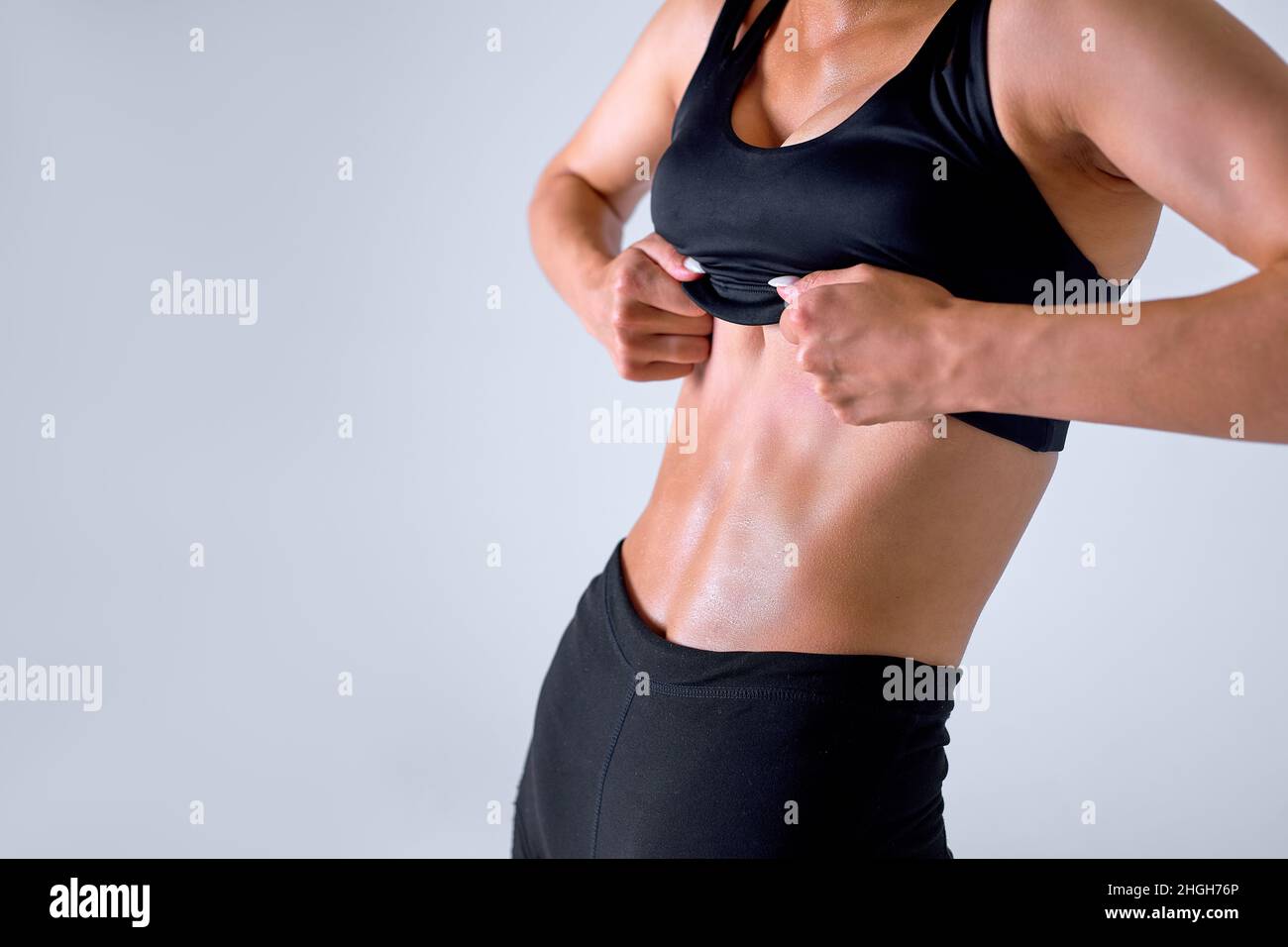 Cut view of slim well built young woman posing on camera, showing ...