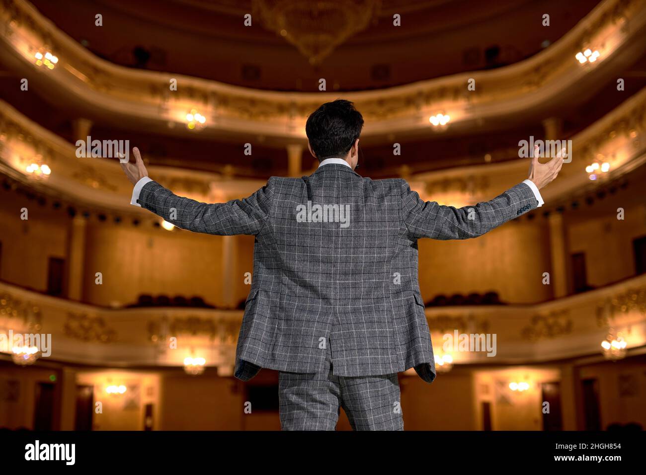 rear view on caucasian brunette man in elegant stylish gray suit ...