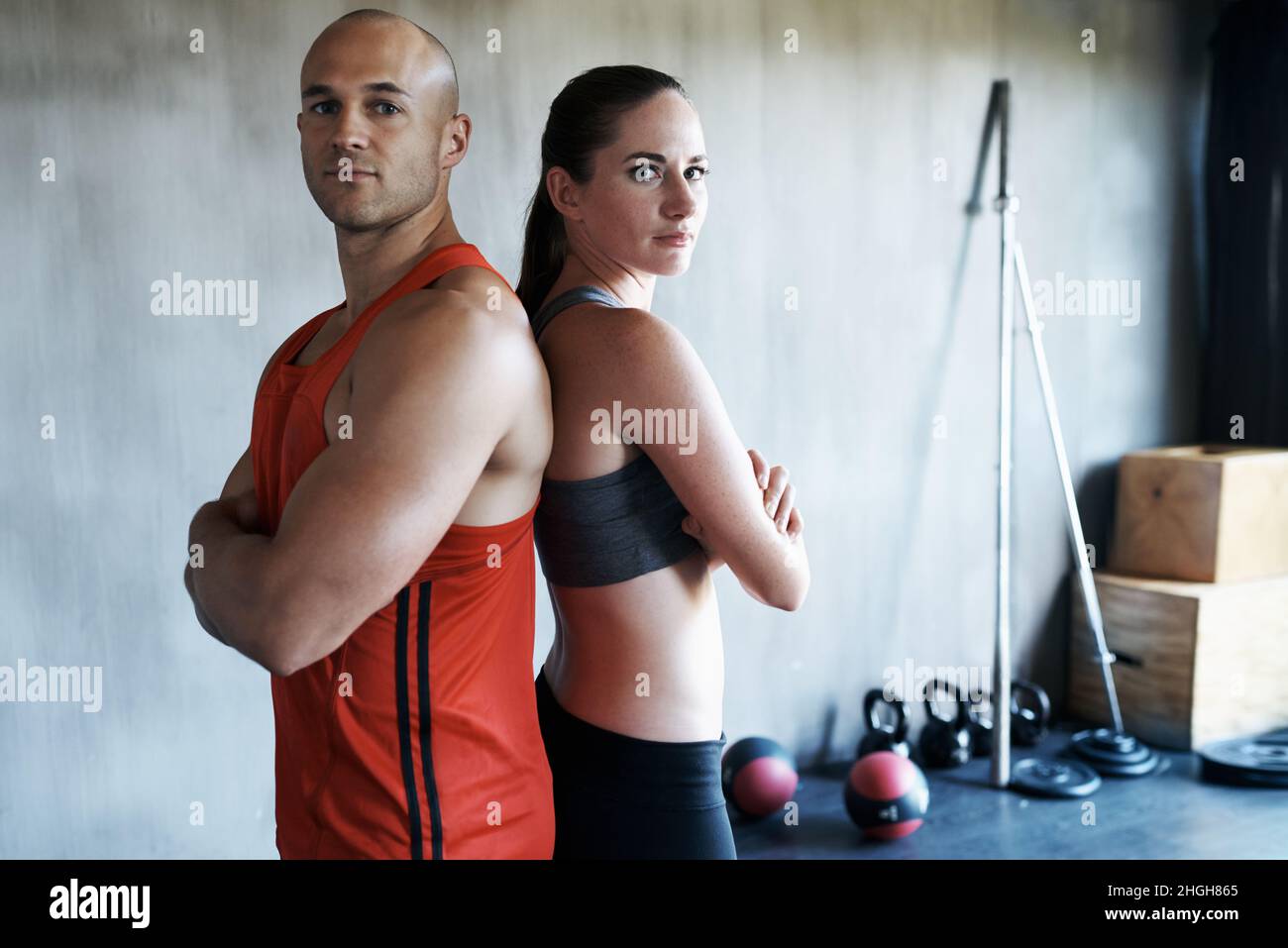 Training to become fighting fit. Portrait of a young couple training ...