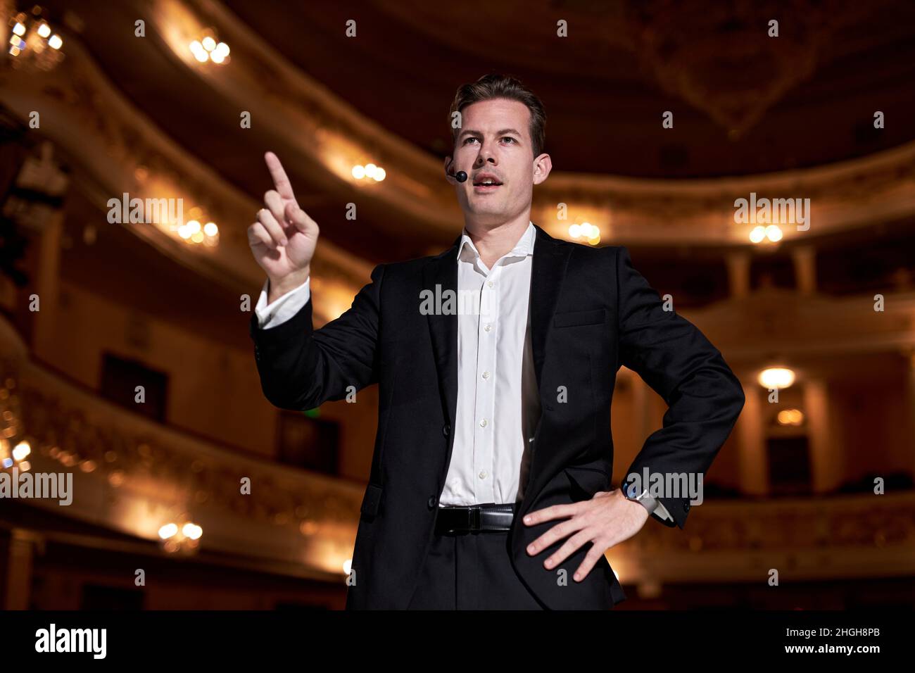 Skilled businessman standing on stage. Star, show, speech and ...