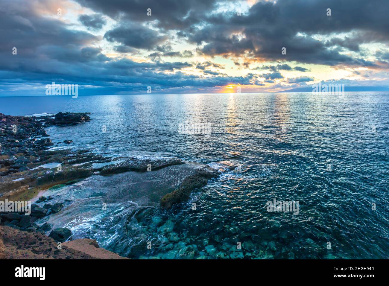 Beautiful sunset on Tenerife canary island coast with rocks and ...