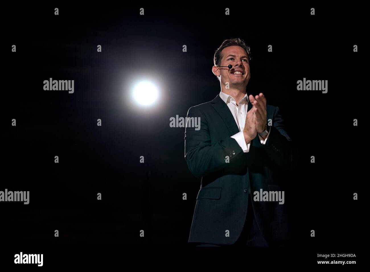 happy attractive and confident successful man speaking at corporate ...