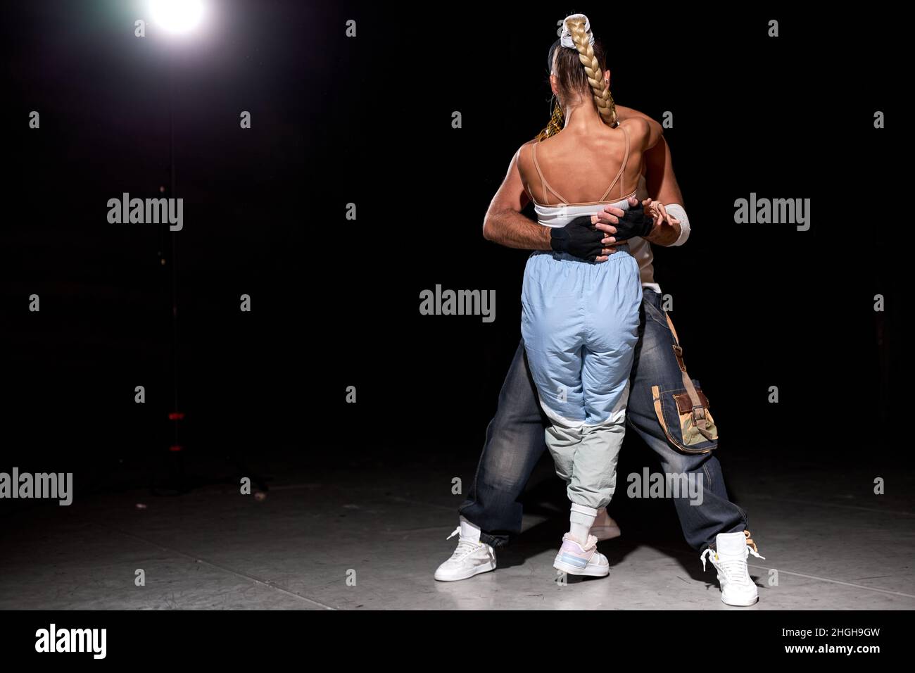 Modern. Fashionable young european couple dancing hip-hop in stylish ...