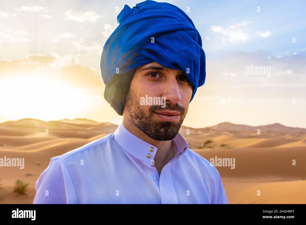 Young arabic man wearing traditional berber clothes in the Sahara ...