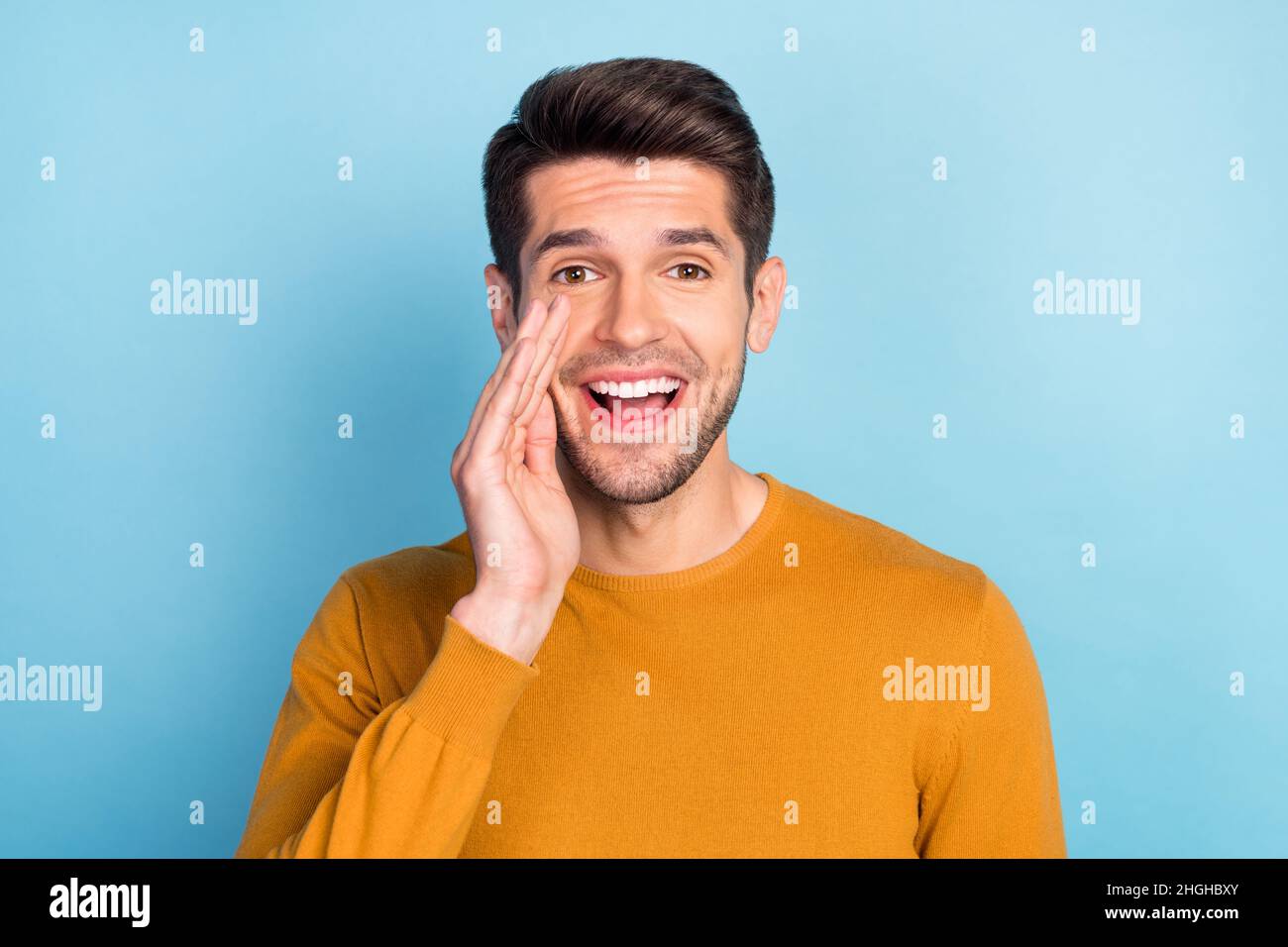Photo of young cheerful man happy positive smile hand near mouth tell ...
