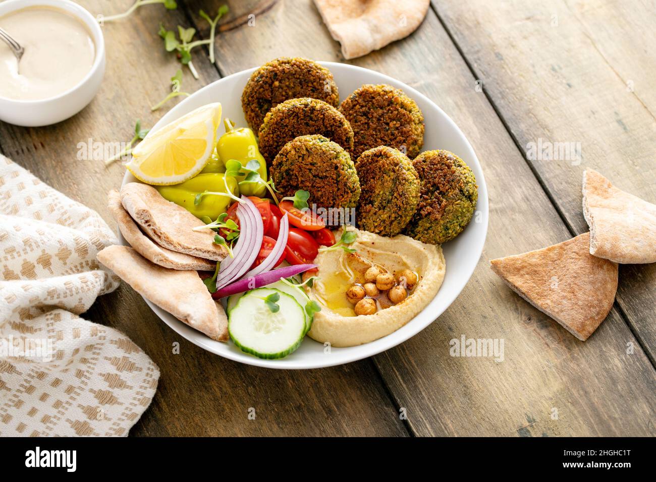 Baked falafel bowl with hummus and vegetables Stock Photo - Alamy