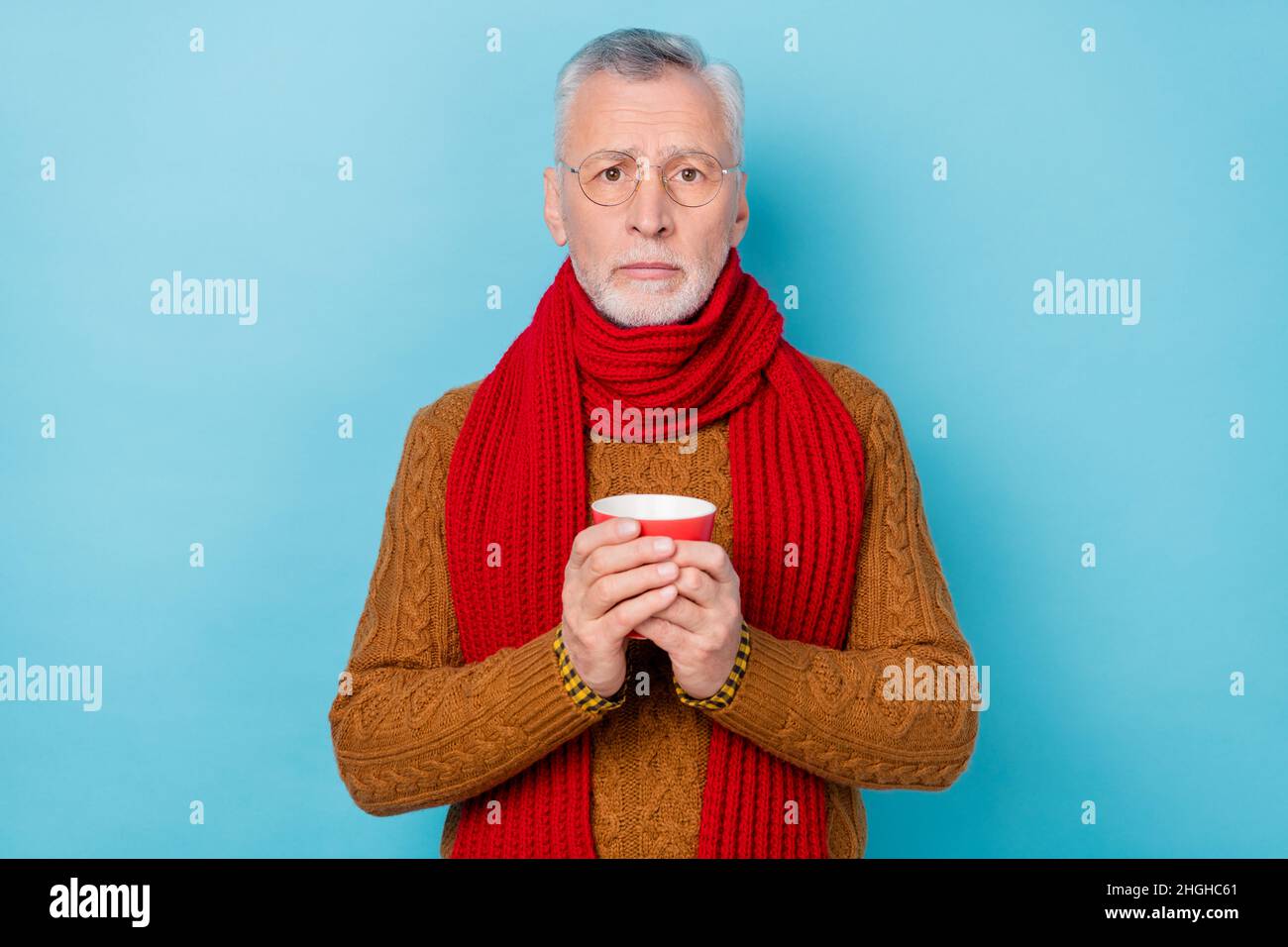 Photo of disappointed man hold hot beverage mug suffer frosty weather ...