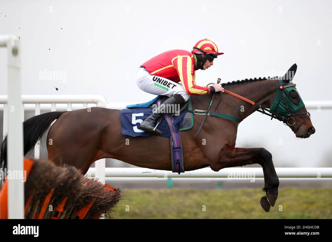 Top Ville Ben ridden by jockey Alain Cawley clears a hurdle on their ...